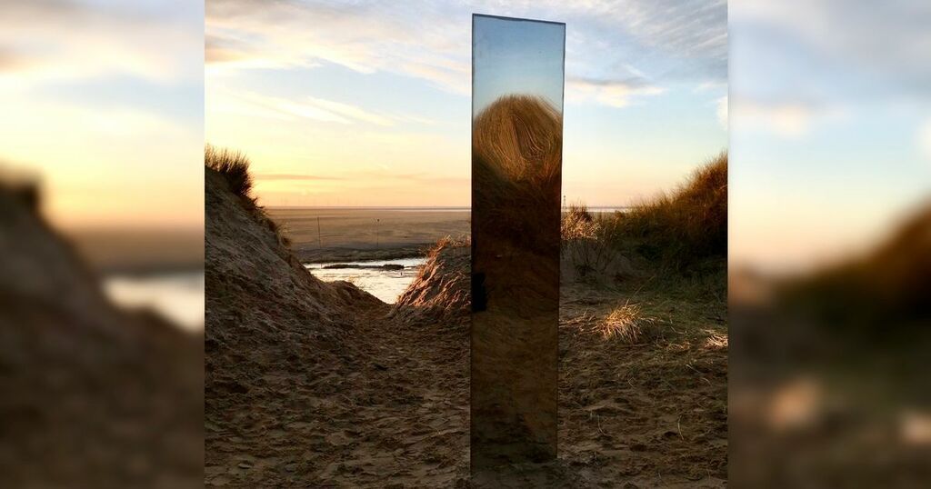 Mysterious monolith sculpture appears in sand dunes of…