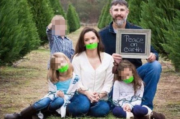 Christmas family photo where women are gagged…