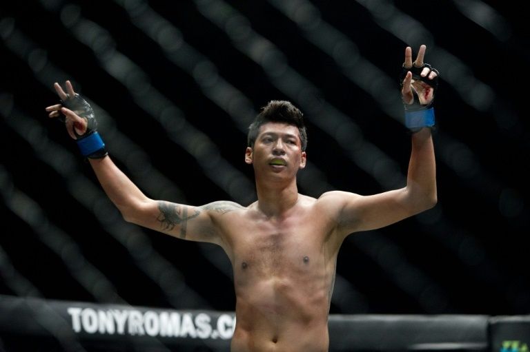 Myanmar's 'Burmese Python' defends MMA fighter…