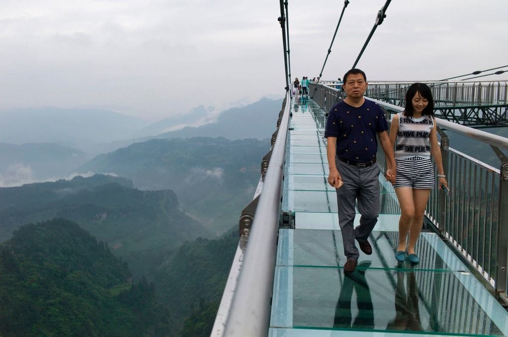 Panels on Chinese glass bridge fall out during…