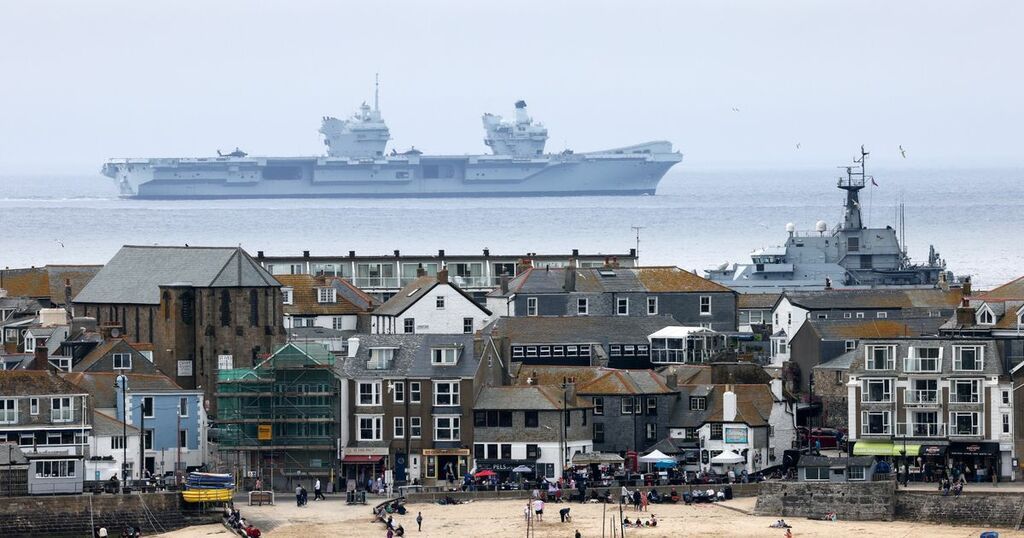 Mind-bending photos show Royal Navy warship 'flying'…