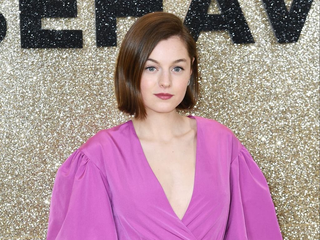 The Crown’s Emma Corrin photographed in chest binder…