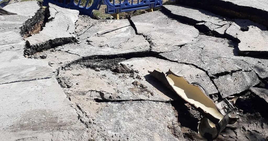 Scots road collapses after burst main opens giant hole…