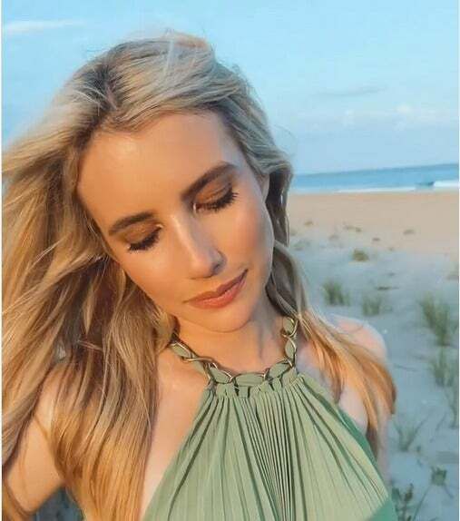 Emma Roberts reacts after her beach walk triggered…