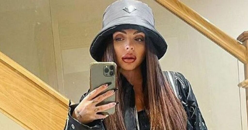 Jesy Nelson pouts in leather jacket and crop top as…