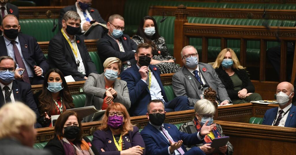 Why do MPs stand up during PMQs in Parliament?