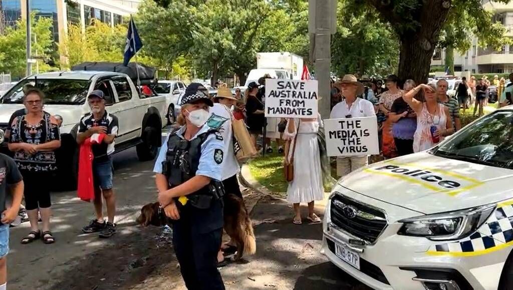 Protesters chant 'arrest ScoMo' outside National Press…