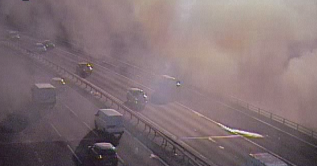 Car blaze sends smoke billowing across M90 as huge…