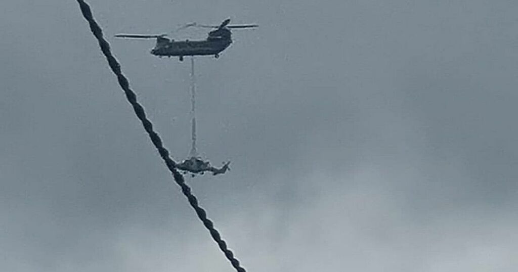 Rare sight of Chinook carrying another military…