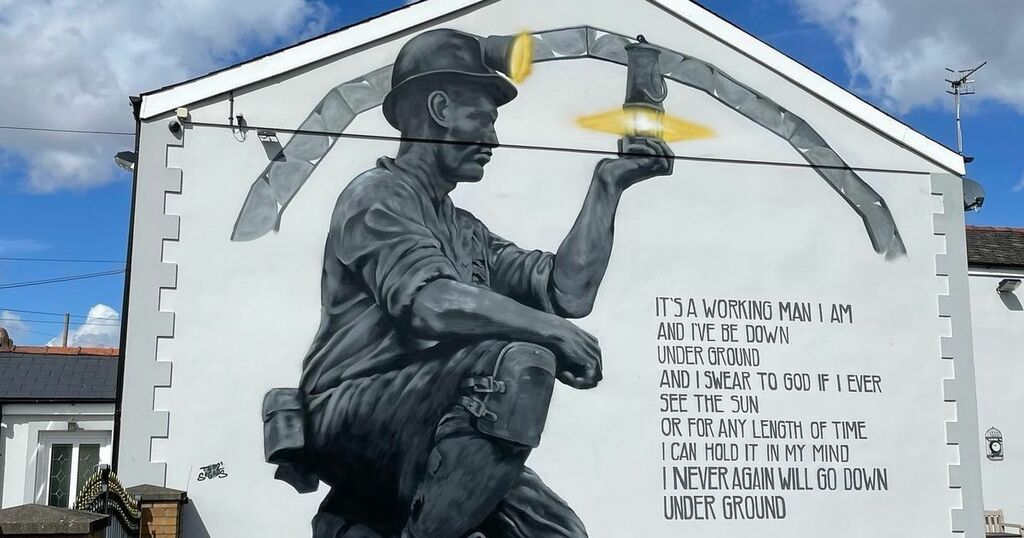 The striking mural of a miner that's appeared to pay…