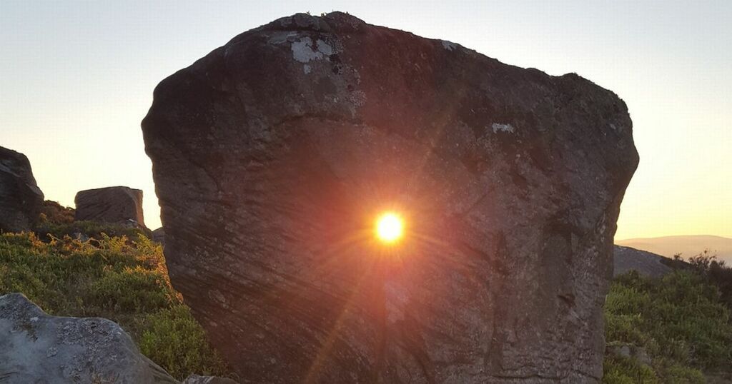 The holed stone that captures the Solstice sunset in…