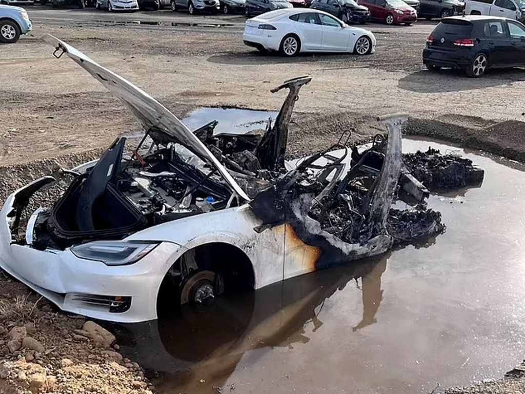 Flaming Tesla has to be buried in pit to extinguish…