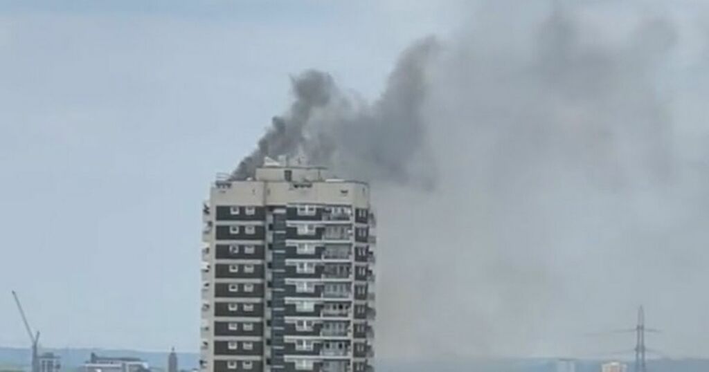 Fire tears through London tower block as smoke billows…