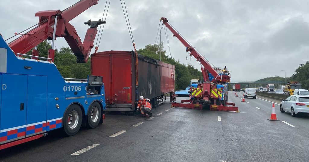 Picture shows burnt-out lorry that caught fire on M62…