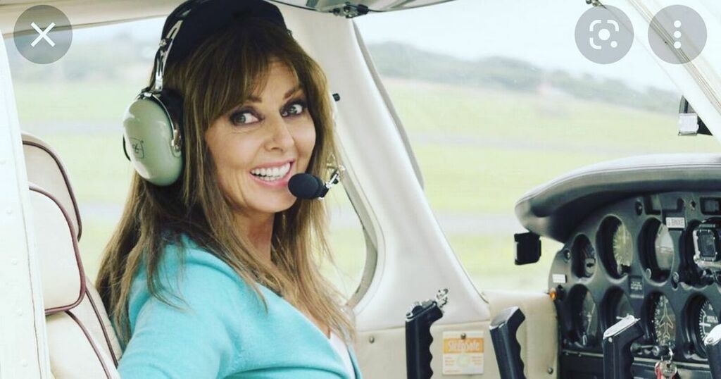 Carol Vorderman beams in the cockpit as she marks 9…