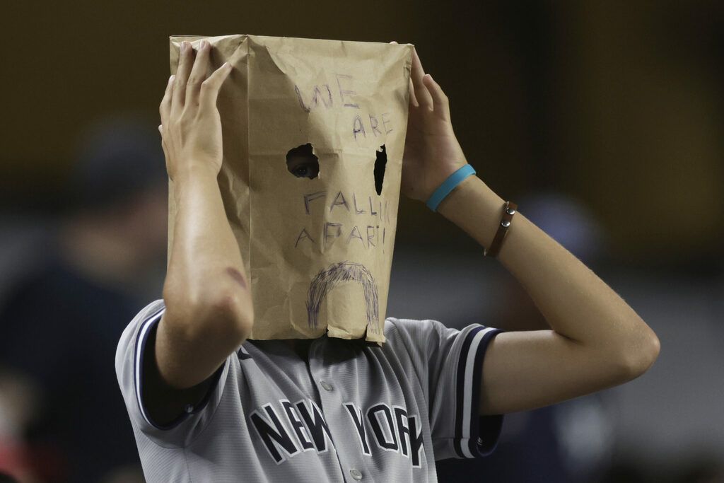 A Yankees fan was caught making a hot dog straw and…