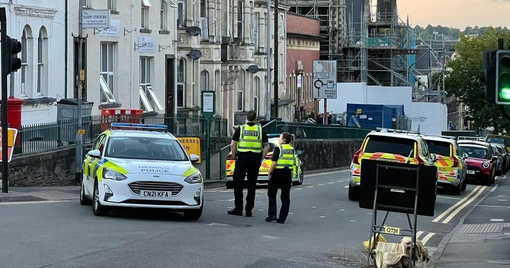 Armed police close road after witnesses report seeing…