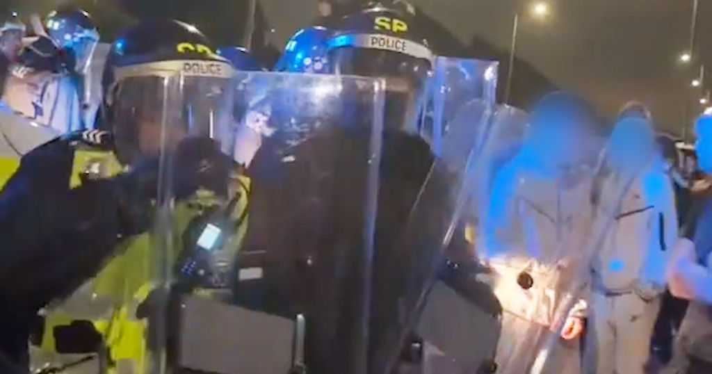 Angry mob shouting 'beast out' gather in Scots street…