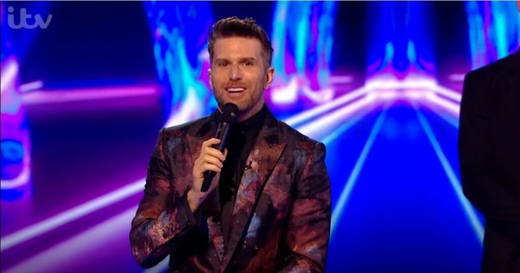 ITV The Masked Dancer host Joel Dommett distracts…