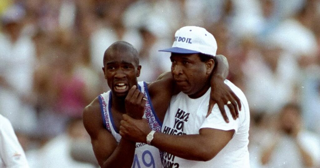 Father who helped son finish 400m race in iconic…