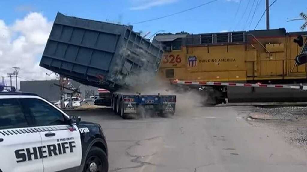 Watch Train Hit A Truck, Toss 50,000 LBS Of Cargo Like…