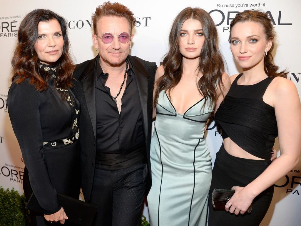 Bono says he and his family received death and…