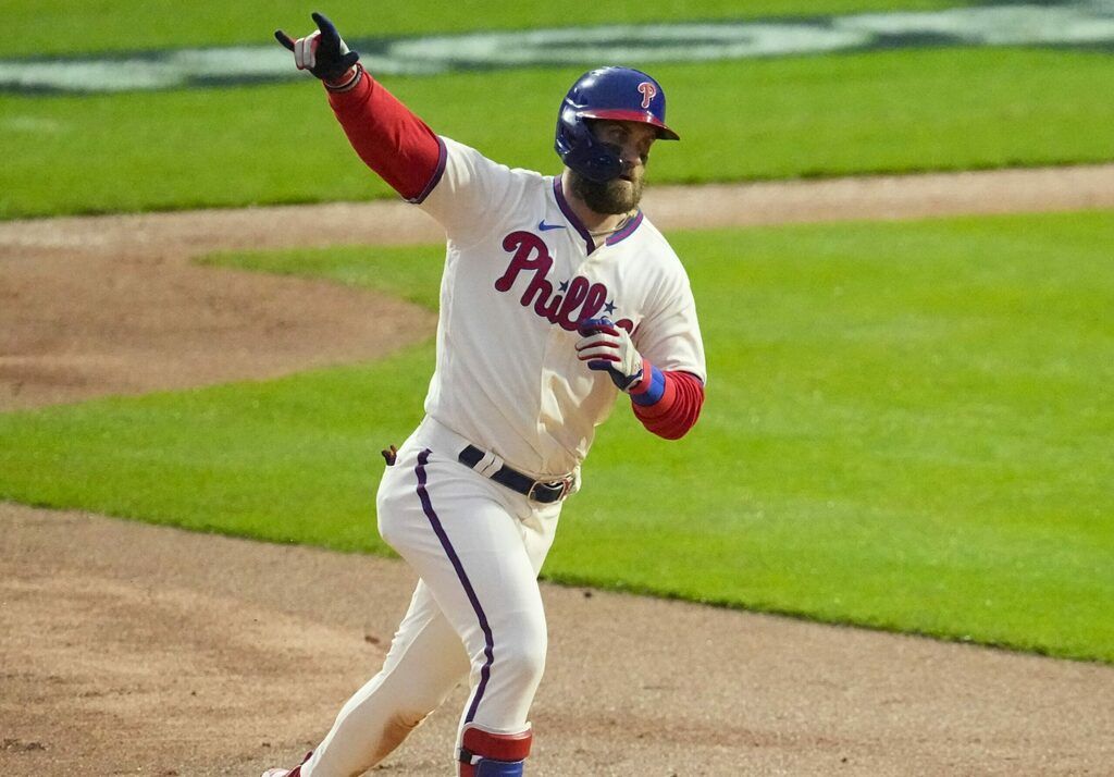 Why Bryce Harper does the ‘I love you’ hand sign after…
