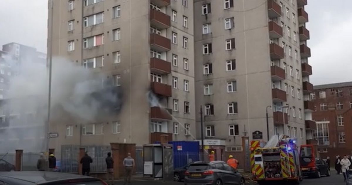 Footage shows smoke billowing from windows as fire…