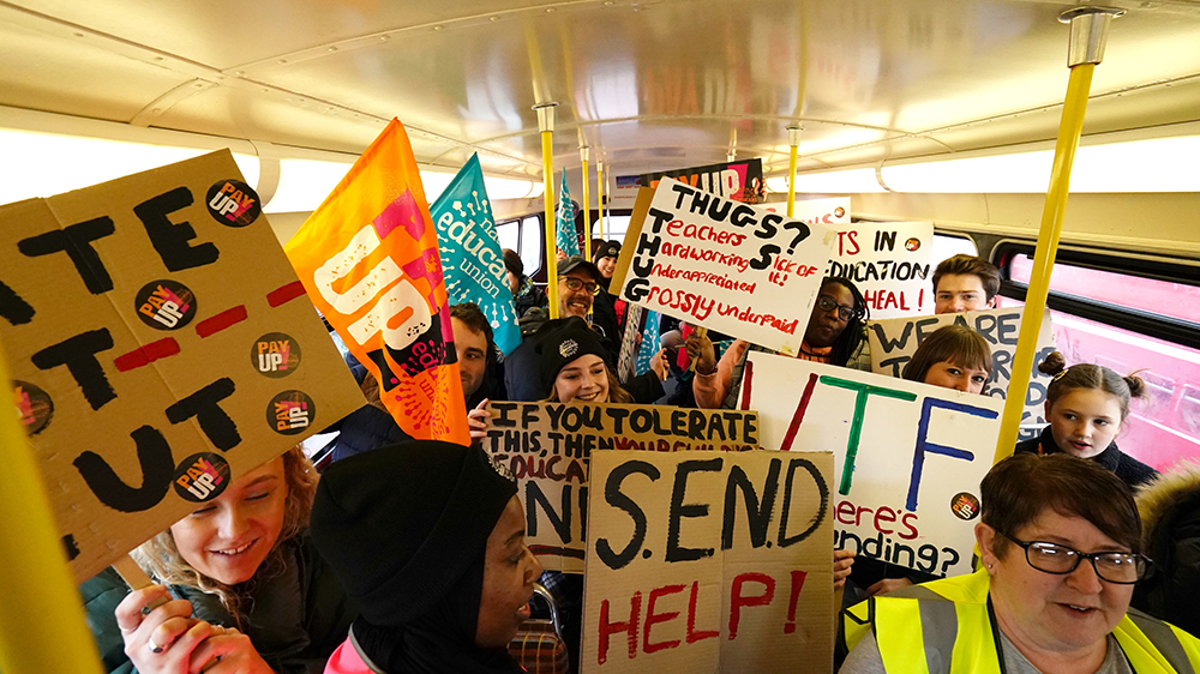 Watch live: Thousands of striking workers march…