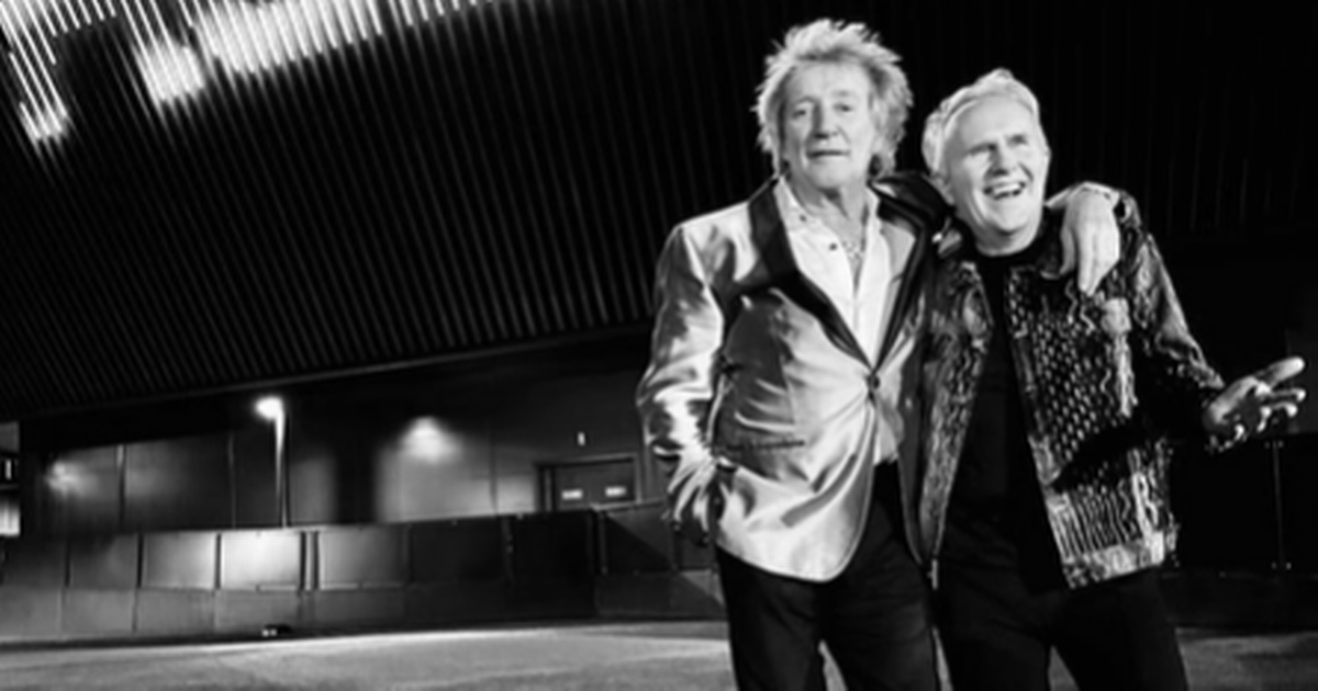 Rod Stewart and Howard Jones pose for picture outside…