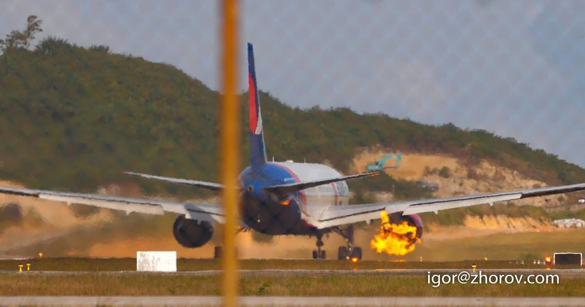 Terrifying moment tourist plane's tyres explode as…