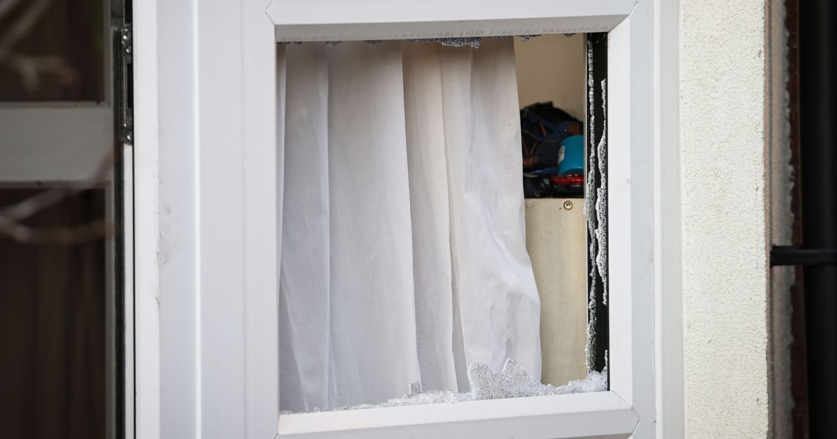 Forensics comb through house with broken window at the…