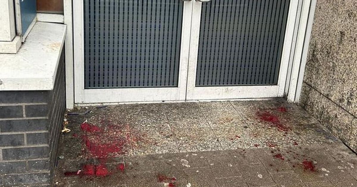 Pools of blood outside building as man hospitalised in…