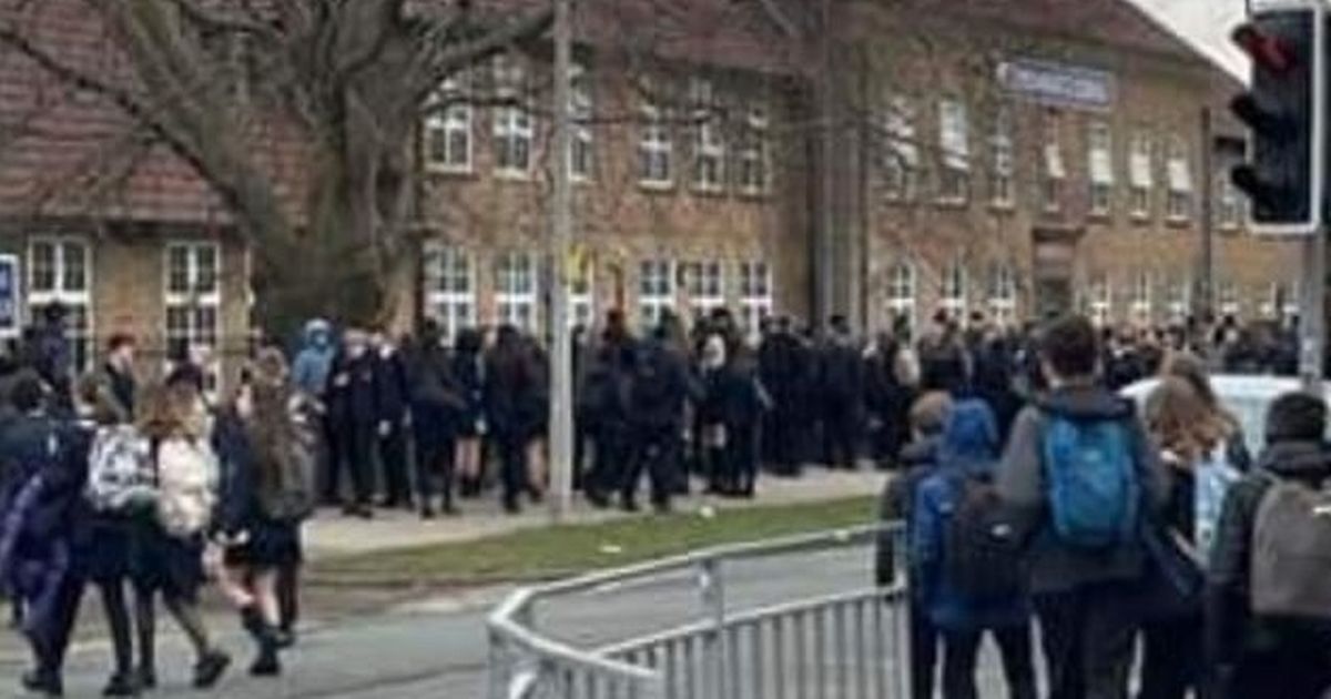 Pupils seen in 'ridiculous' queue outside school after…