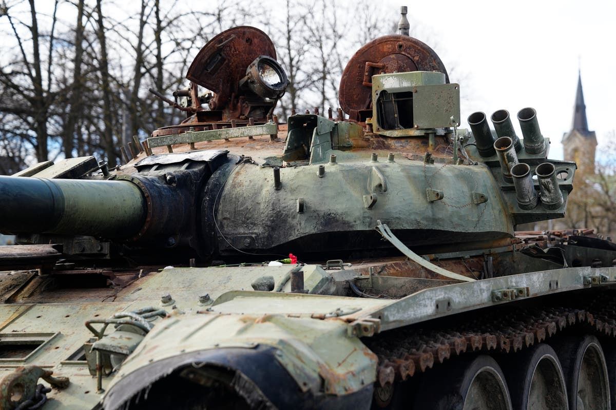 Russians place flowers at burnt out tanks in Baltic…