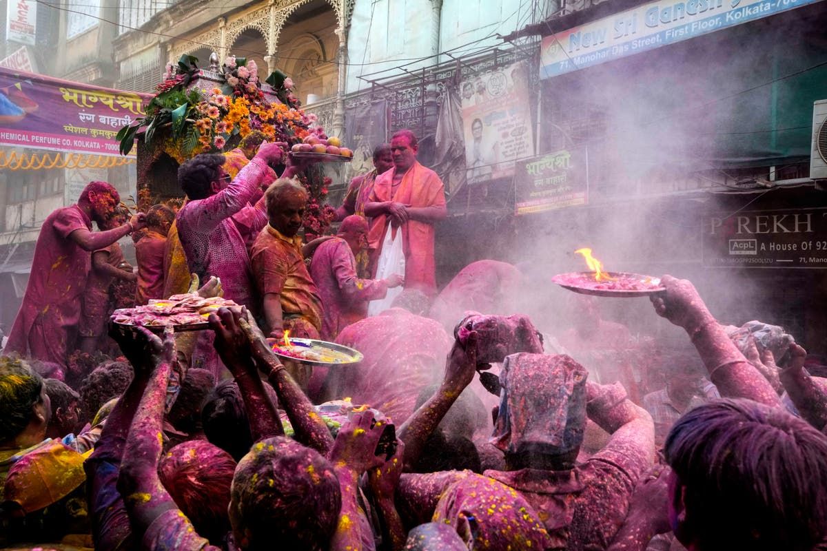 AP PHOTOS: Indians celebrate Holi, Hindu festival of…