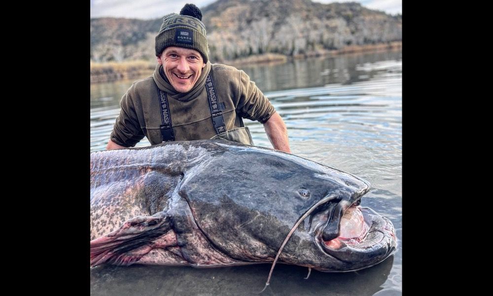 Despite freezing, angler lands 222-pound catfish after…