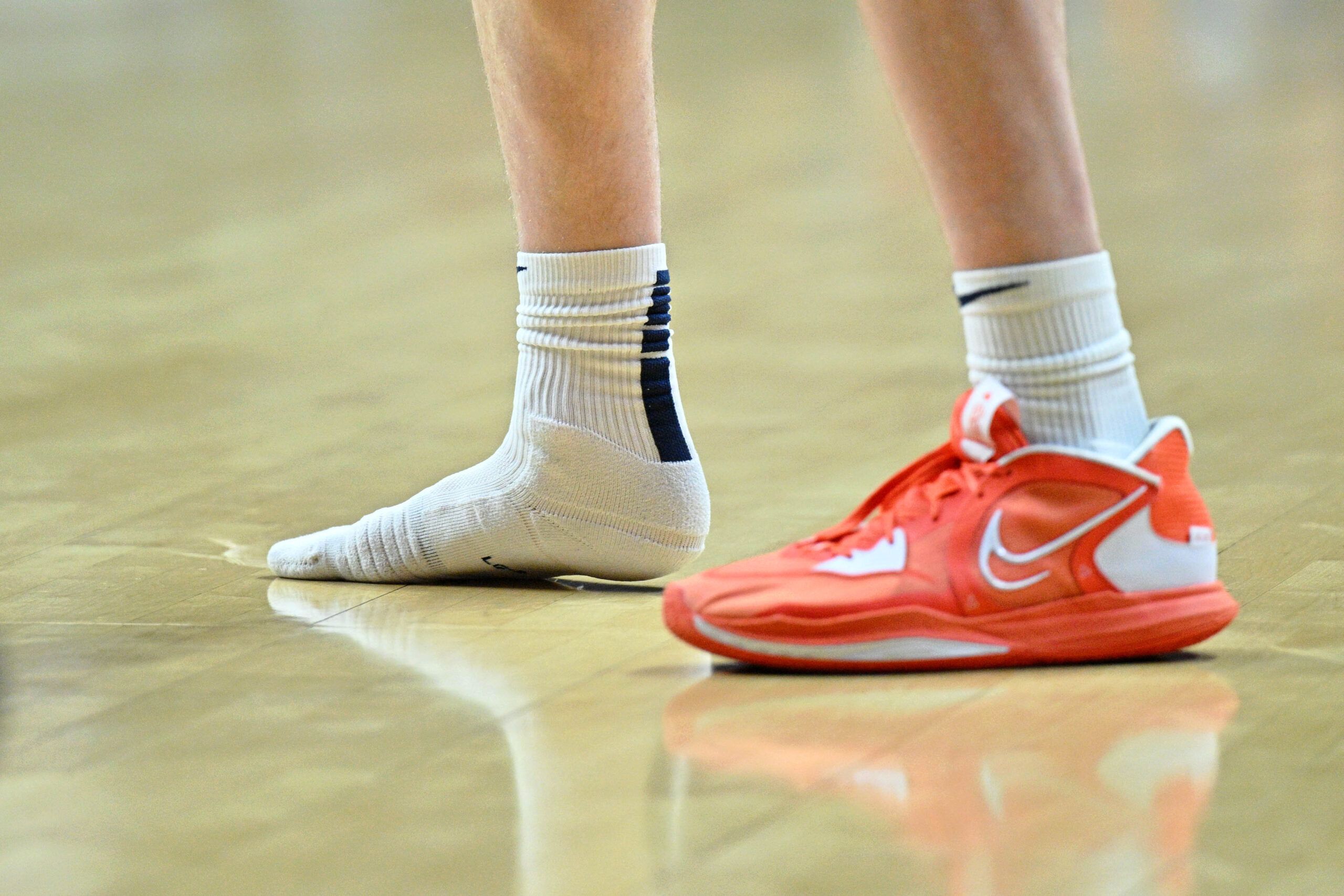 Illinois’ Matthew Mayer played with just one shoe for…