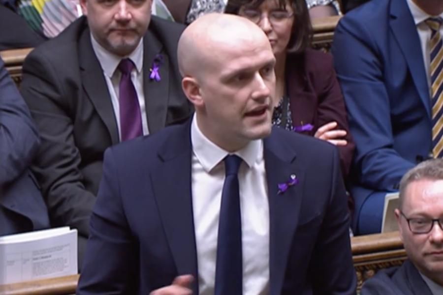 Why were SNP MPs wearing purple ribbons at PMQs?
