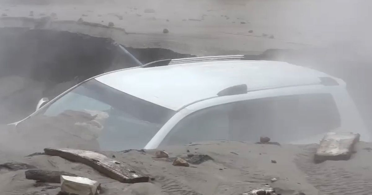Horror moment car with family INSIDE is swallowed up…