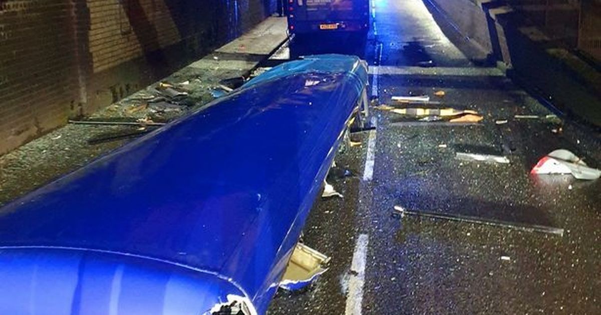 Roof of double-decker bus ripped off after crashing…