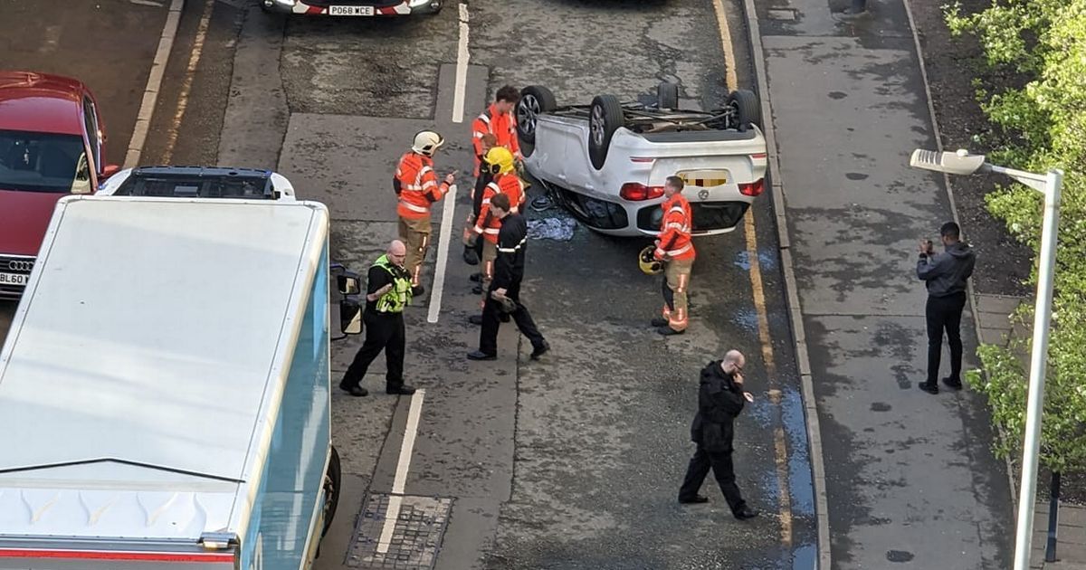 Mercedes flips onto roof in dramatic city centre crash…