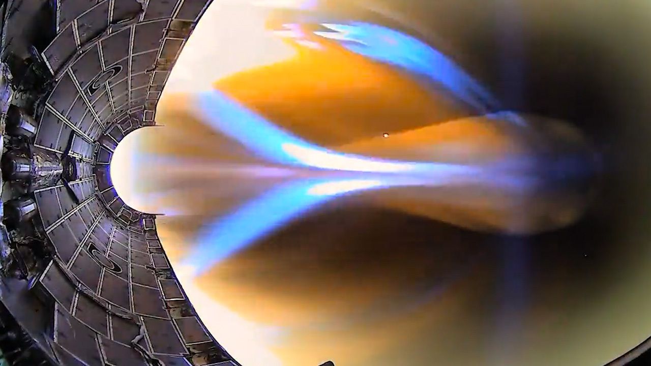 Watch SpaceX Falcon Heavy fairing make fiery re-entry…