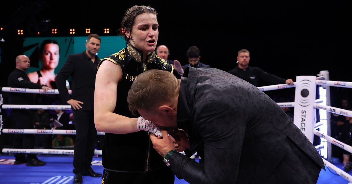 Conor McGregor kisses Katie Taylor's hands after…