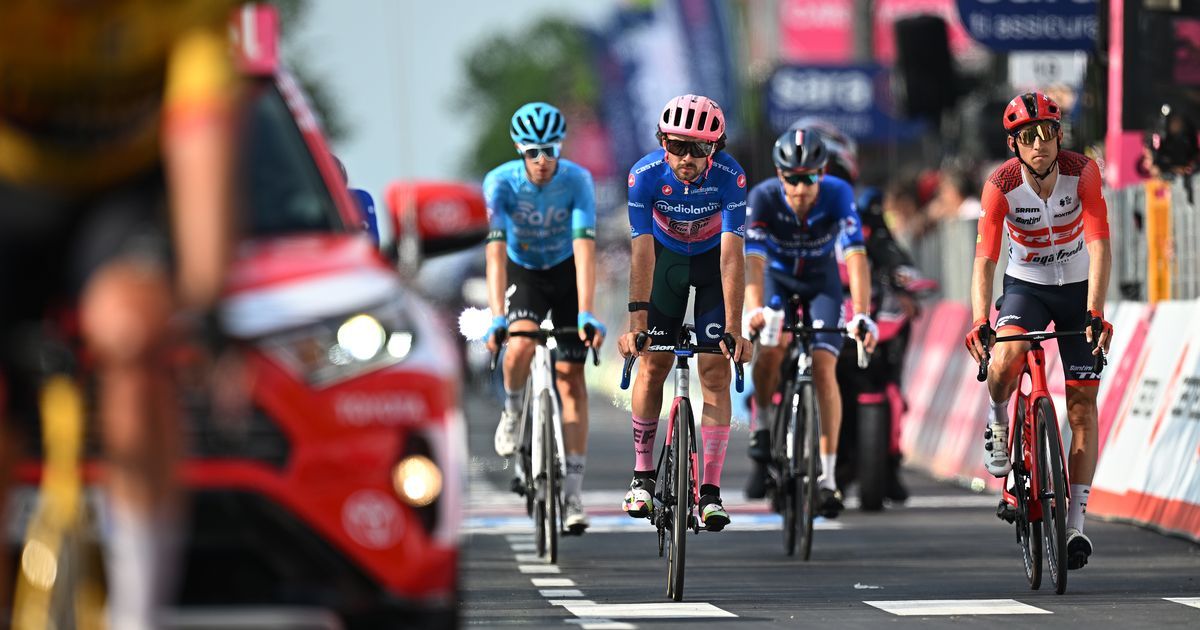 Ben Healy holds onto blue jersey as Alberto Dainese…