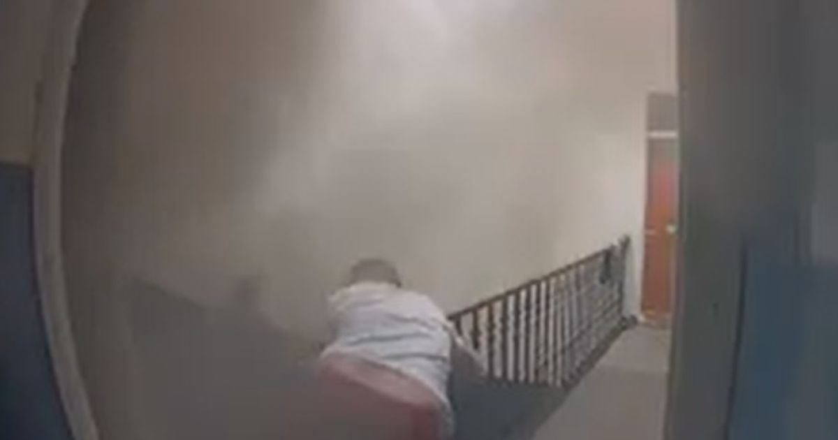 Dramatic footage shows hero neighbours kick down door…