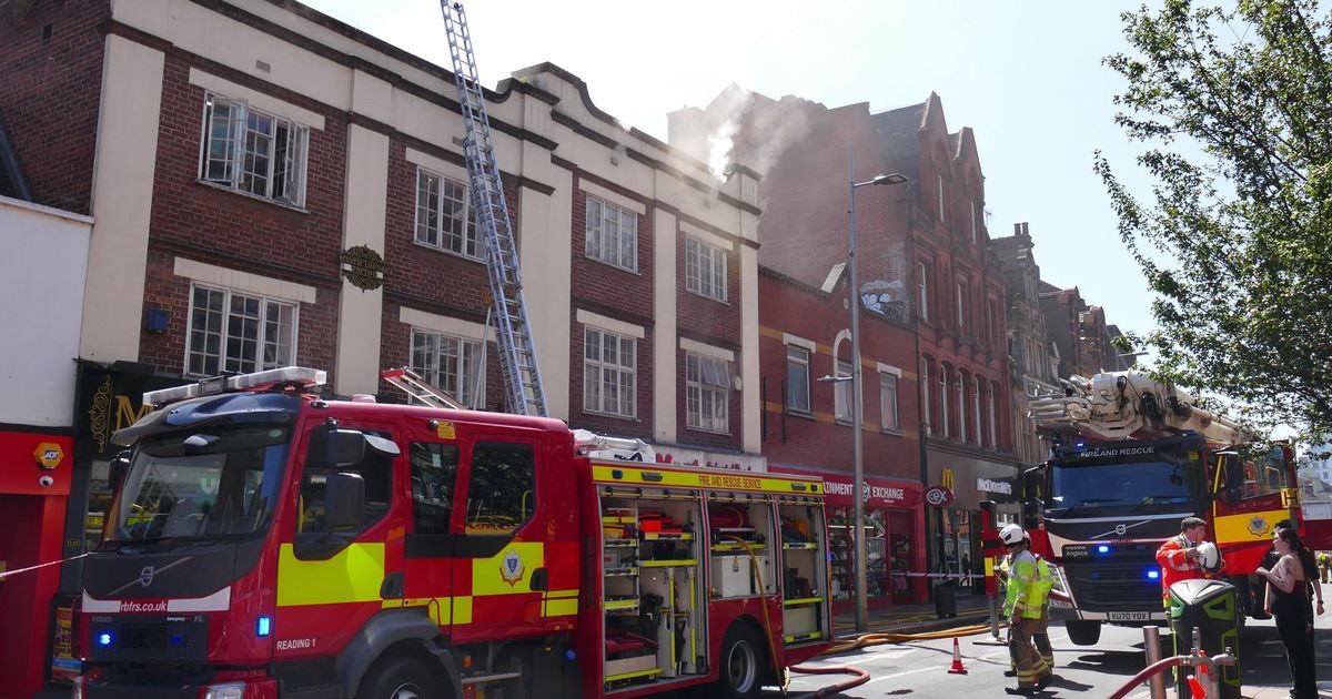 Supermarket on fire in busy town centre as cloud of…