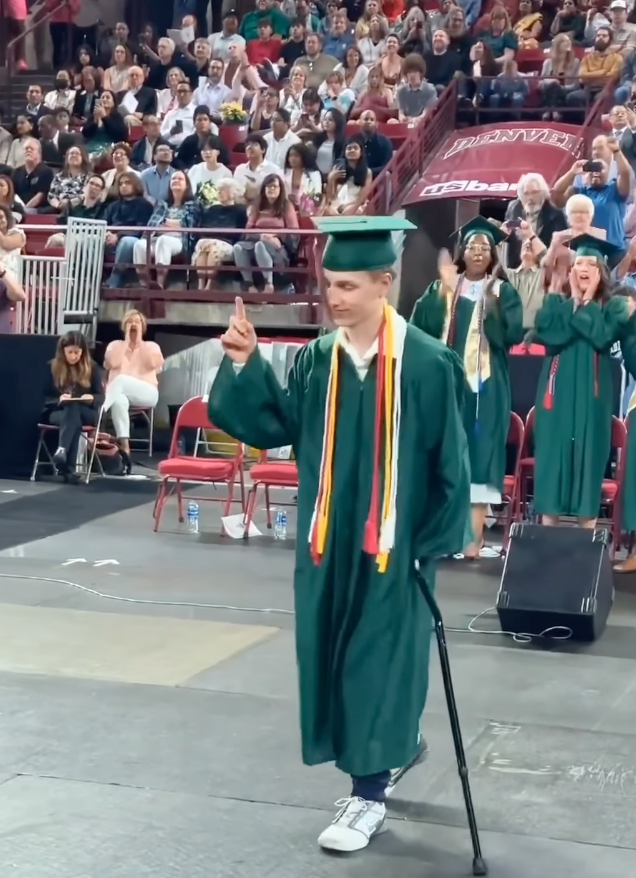 Paralyzed student takes inspiring steps during high…