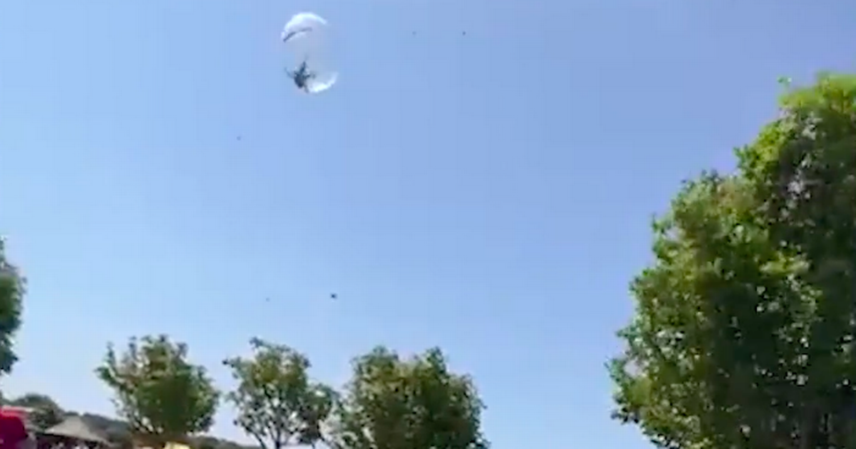 Child filmed falling 20ft from sky in inflatable…