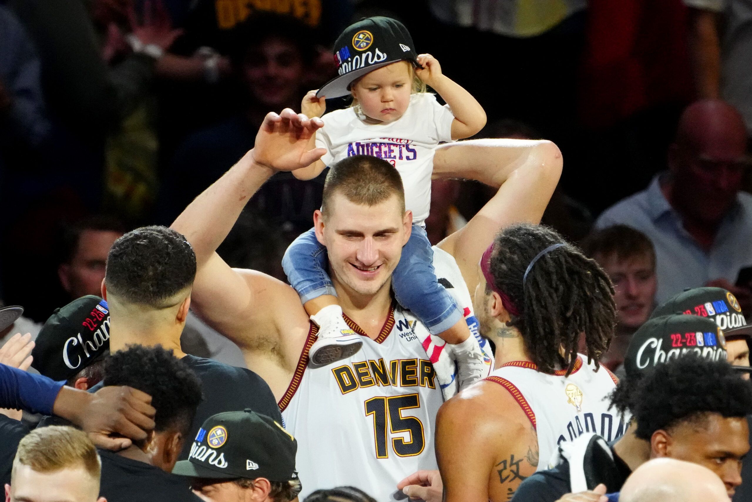 Nikola Jokic celebrating an NBA championship with his…